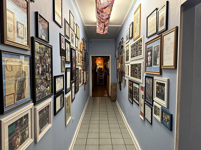 The hallway of fame—where photos tell stories of countless meals, celebrations, and the occasional food-induced proposal.