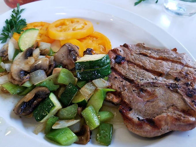 This pork chop with sautéed vegetables isn't just lunch—it's what happens when breakfast ingredients grow up and get sophisticated.