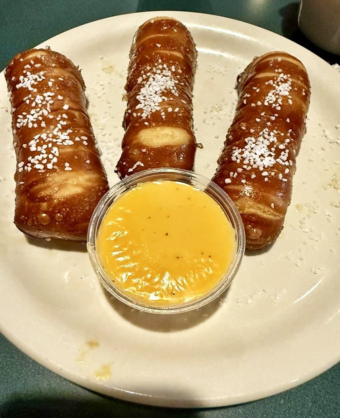 These pretzel sticks aren't just appetizers—they're doughy magic wands that transform ordinary cheese sauce into an extraordinary experience.