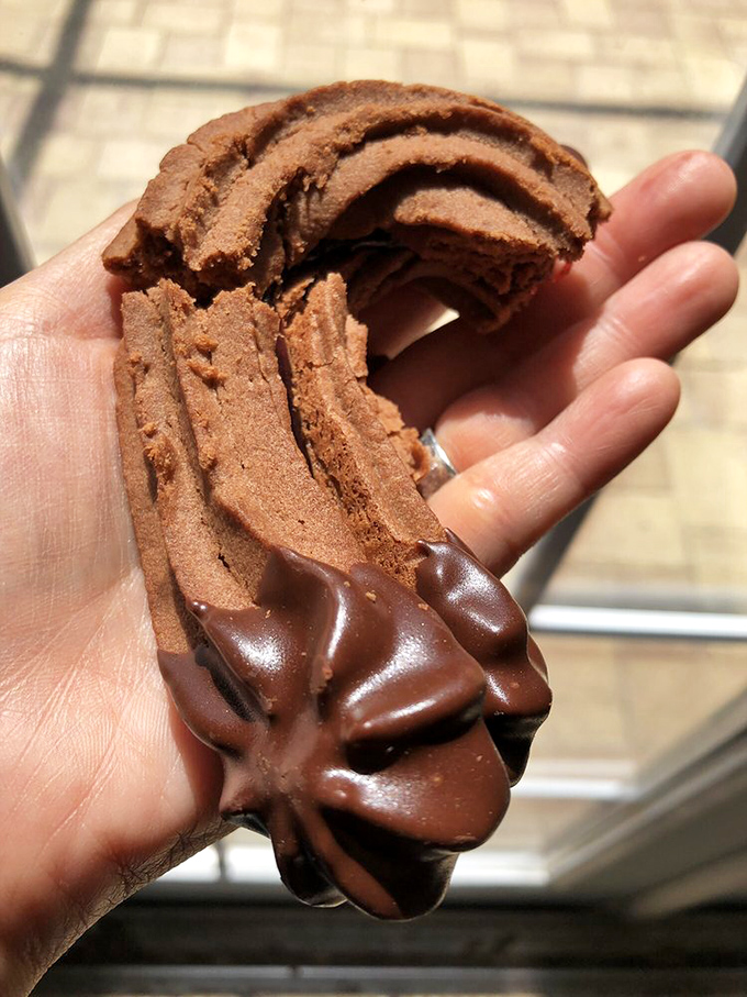 This chocolate-dipped cookie isn't just dessert—it's architecture, engineering, and pure indulgence in one handheld package. Resistance is futile.