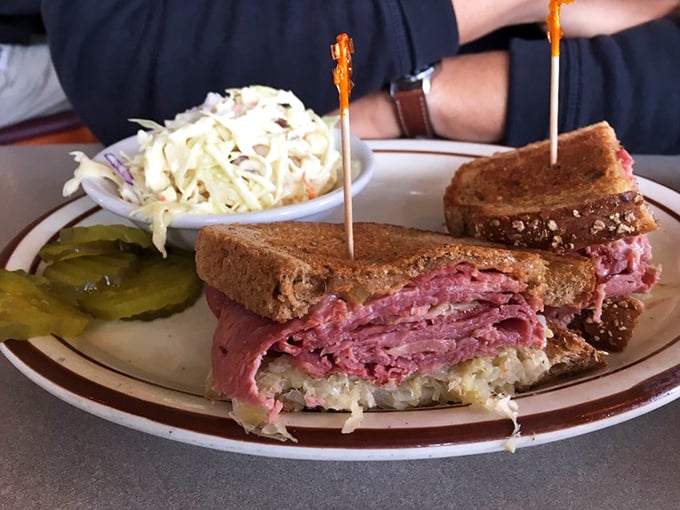 The Reuben sandwich: where pastrami, sauerkraut, and Russian dressing perform a perfectly choreographed dance between two slices of grilled rye.