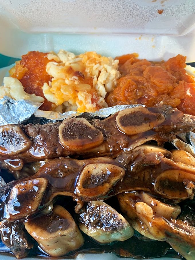 Ribs bathed in glossy sauce alongside vibrant sides create a plate worth driving miles to experience.