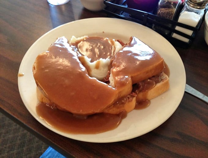 Hot roast beef sandwich swimming in gravy—proof that sometimes the most beautiful things in life aren't meant to be eaten daintily.