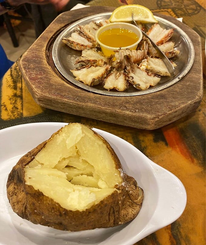 Rock shrimp and seafood platters that make you question why you ever eat anything else. The wooden serving board adds that touch of rustic elegance.