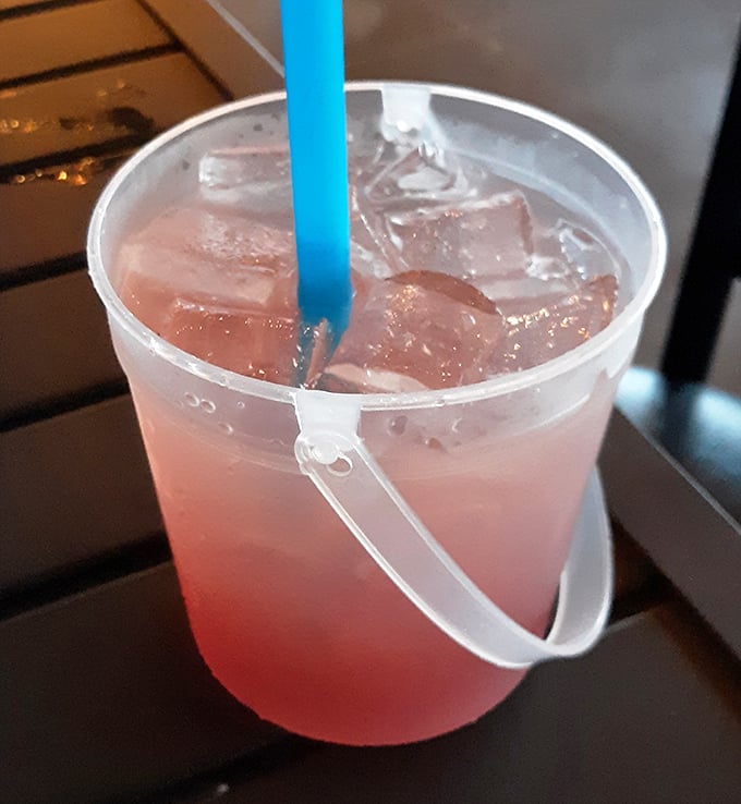 A pink bucket drink that says "vacation mode activated," even if you're just playing hooky on a Tuesday.