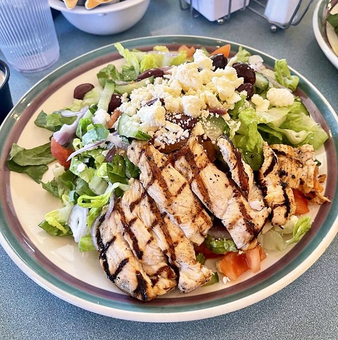 A salad that doesn't apologize for being healthy – it's too busy showing off those perfect grill marks and that generous sprinkle of feta.
