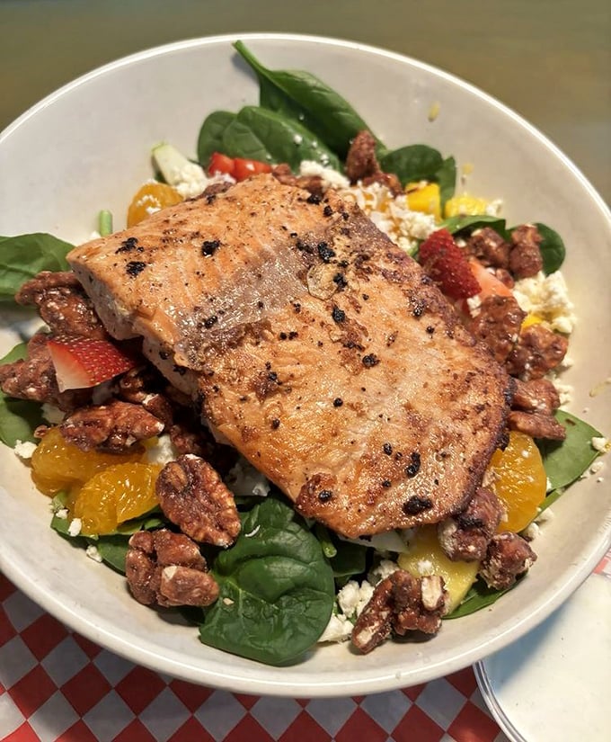 A colorful salad topped with perfectly grilled salmon proves Big Billy's isn't just for those seeking a magnificent cheat day.