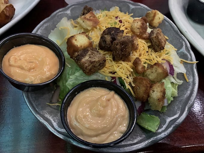 A salad that's having an identity crisis as comfort food. Those croutons are basically tiny flavor sponges soaking up that magnificent sauce.