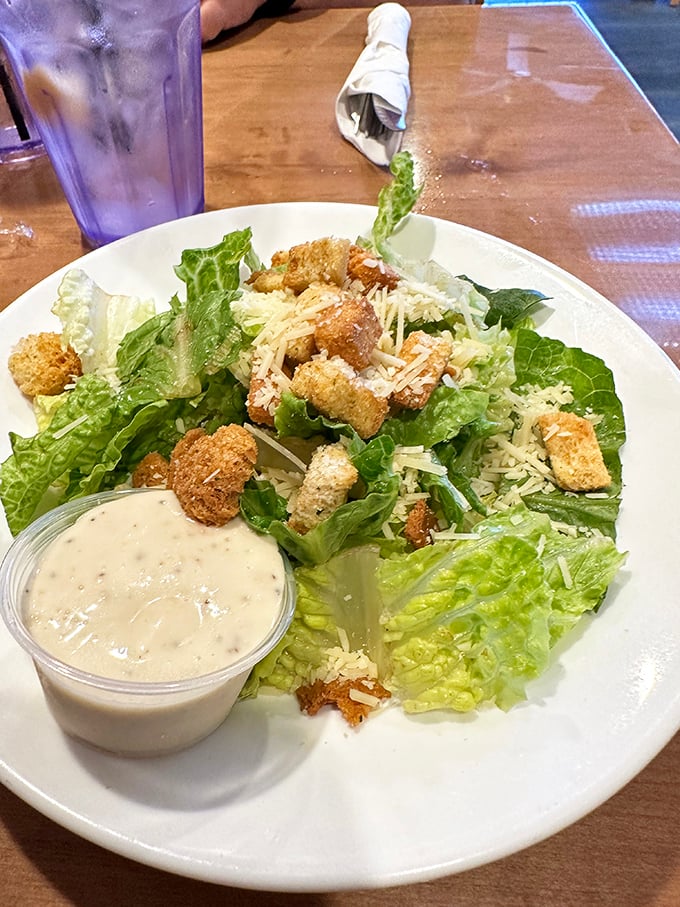 A Caesar salad that understands its purpose: crisp romaine, crunchy croutons, and creamy dressing in perfect harmony.