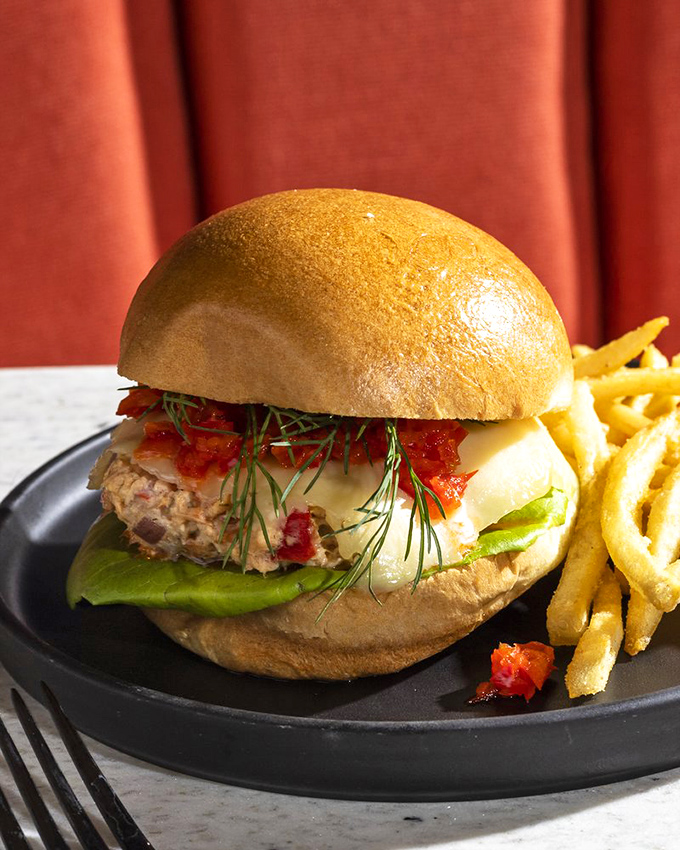 A salmon sandwich that makes fish-skeptics reconsider their life choices. Fresh, vibrant, and dressed to impress with those feathery dill accents.