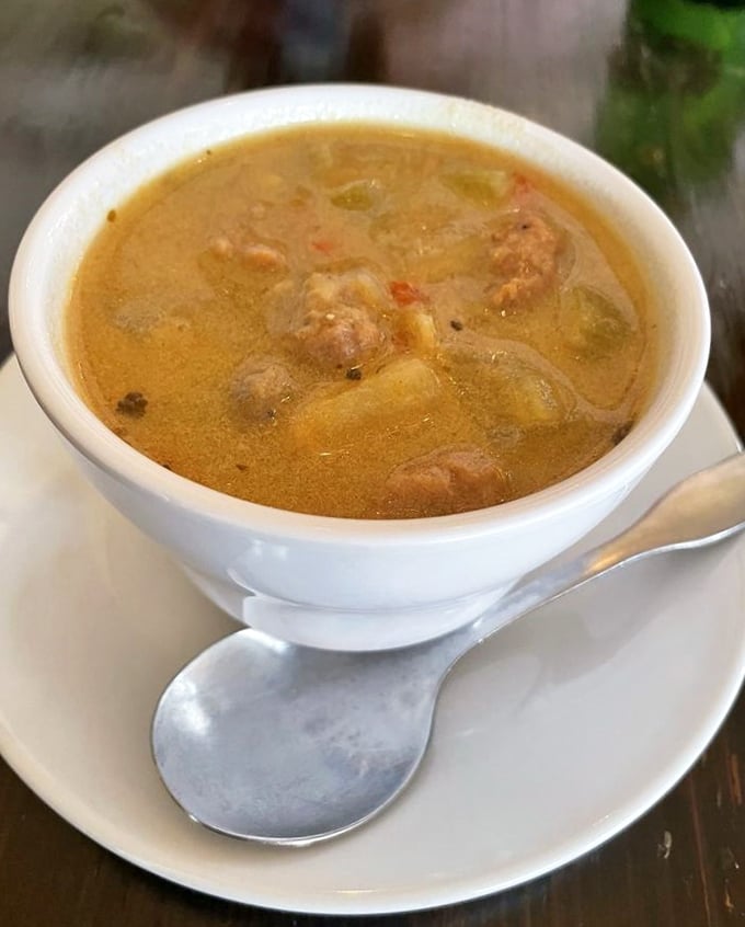 This isn't just soup—it's liquid comfort in a bowl. The chunks of sausage and vegetables are playing a delicious game of hide and seek.