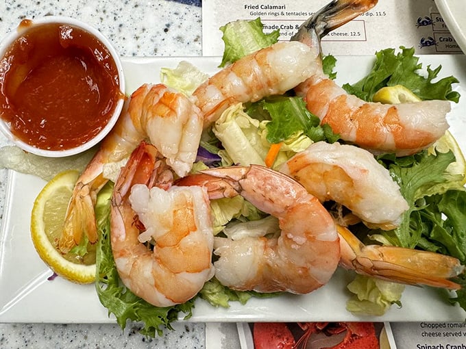 Plump shrimp lounging on a bed of lettuce like they're at a spa—except they're about to meet their delicious destiny.