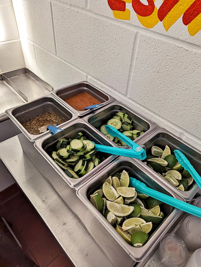 The condiment station—a treasure trove of fresh limes, cucumbers, and salsas that transform good tacos into personalized masterpieces.