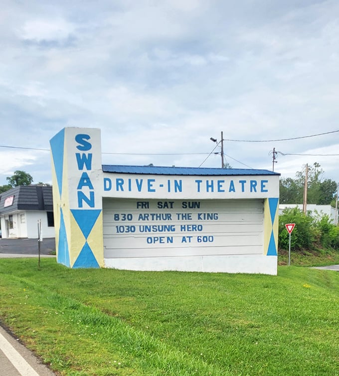 The iconic blue and white marquee announces double features and opening times, a roadside billboard for memories waiting to be made.