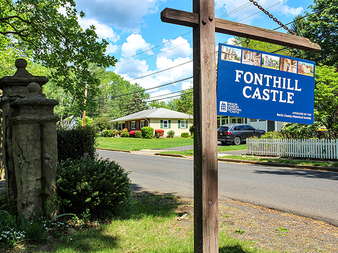 The humble sign belies the wonderland that awaits beyond—like finding Narnia's entrance in a suburban closet. 
