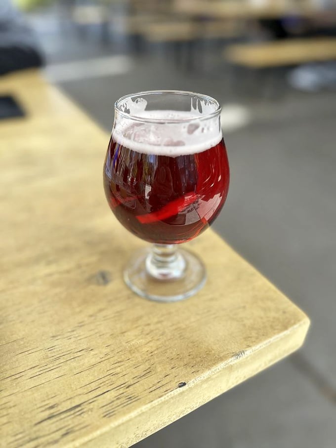 A ruby-hued beer catching the light like liquid amber – the perfect counterpoint to barbecue's rich embrace.