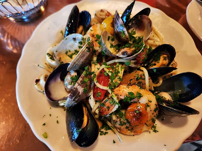Spaghetti ai Frutti Di Mare—where the shellfish outnumber the pasta strands in a glorious seafood-to-carb ratio.