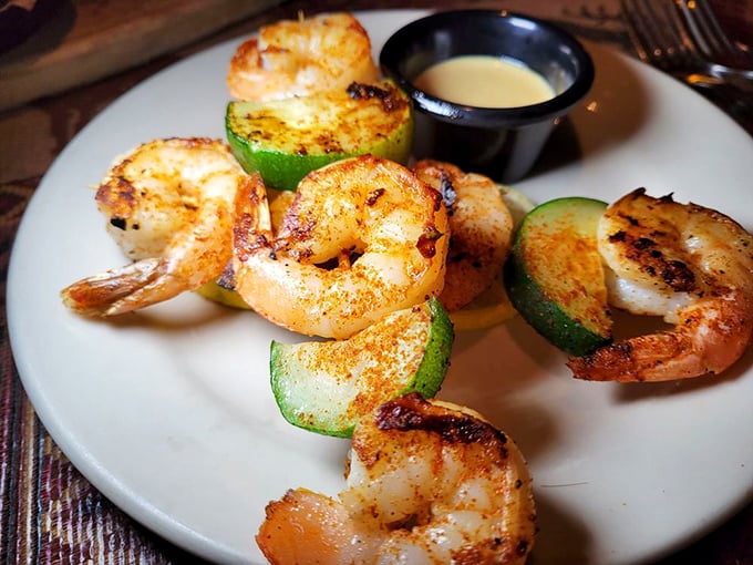 Grilled shrimp nestled against zucchini slices – seafood that tastes like it just jumped from ocean to grill. Simple perfection needs no disguise.