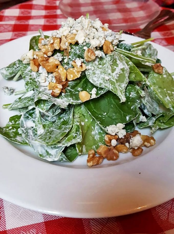A spinach salad that actually excites – creamy dressing, crunchy walnuts, and blue cheese crumbles transform these humble greens into something special.