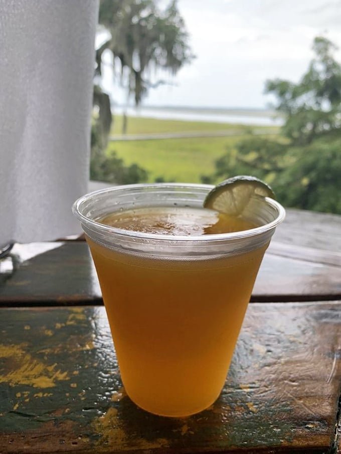 A cold beer with a lime wedge against the backdrop of marshland—sometimes paradise is this simple.