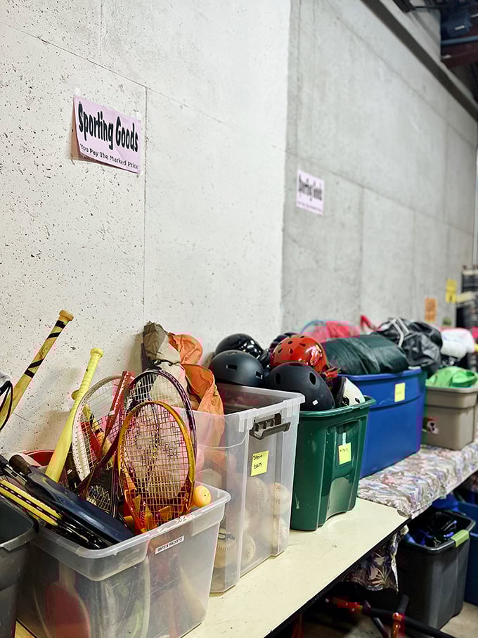 Sports equipment purgatory. Tennis rackets and helmets wait patiently for their second wind with a new weekend warrior.