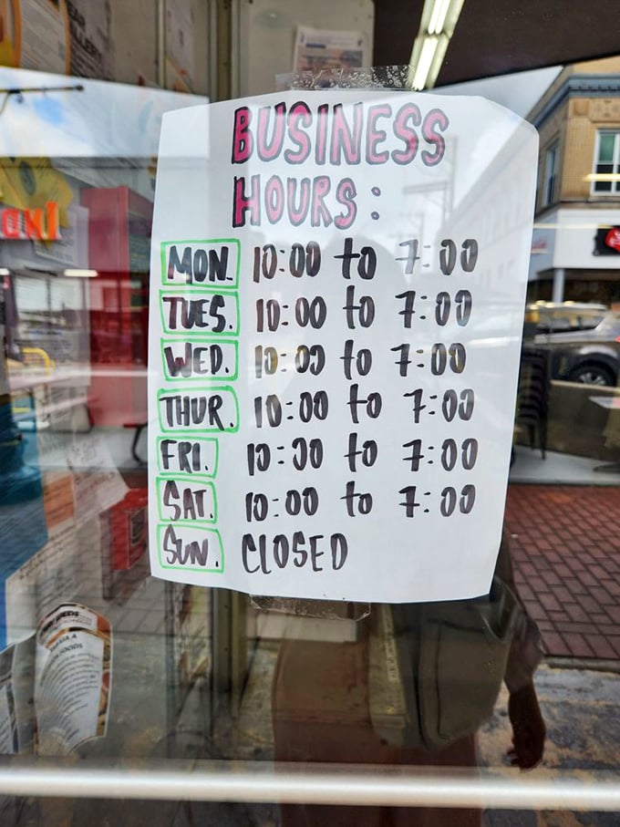 The handwritten hours sign – a charming throwback to pre-digital days when 10-7 meant there was always time to browse after work.