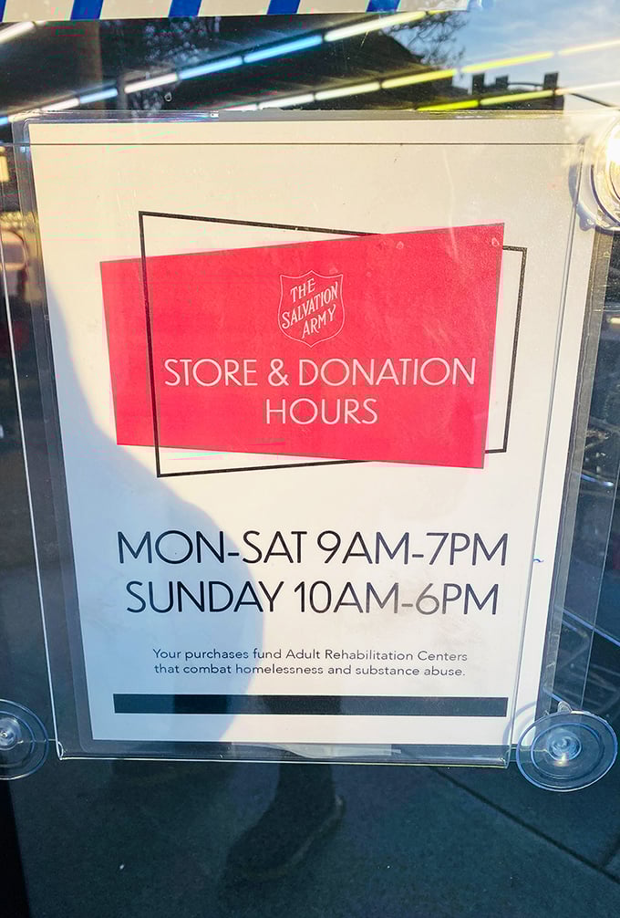 The store hours sign reminds us that every purchase funds programs fighting homelessness—shopping with purpose never felt so good.