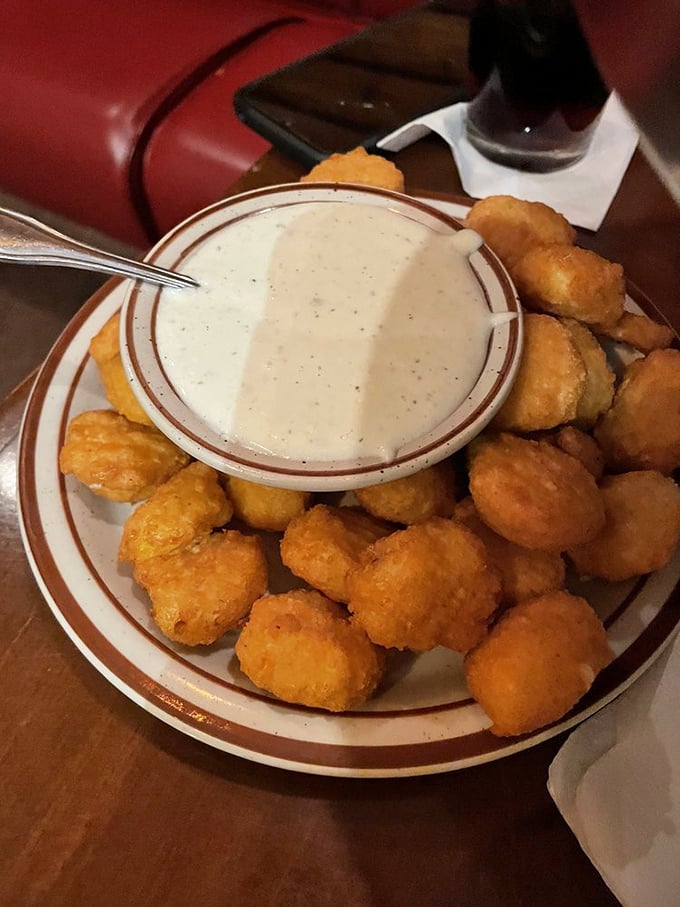 Golden corn nuggets surrounding a creamy dipping sauce—like little nuggets of sunshine that somehow taste even better than they look.