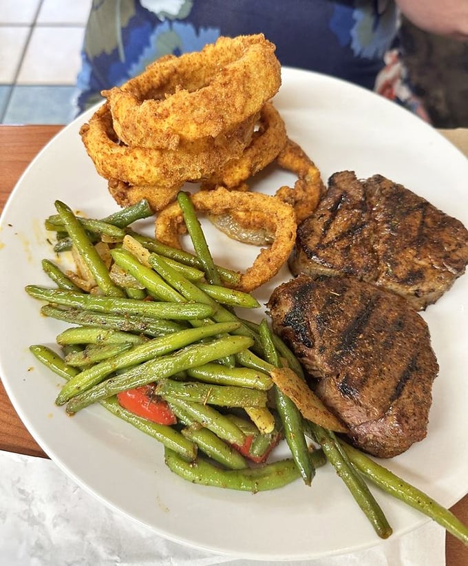 Tenderloin, onion rings, and green beans—the holy trinity of a meal that satisfies both your inner child and your sophisticated adult palate.