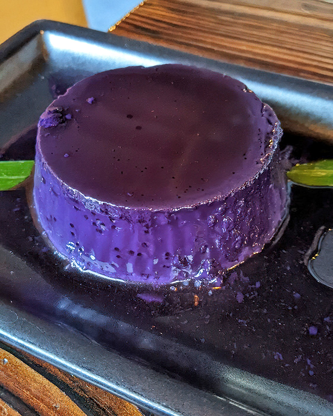 The ube flan—purple royalty on a humble metal plate. This Filipino twist on a classic dessert is what Prince would eat if he were still with us.