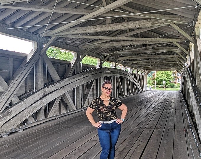 Inside the architectural marvel, wooden beams frame visitors against history—a perfect backdrop for creating memories that will outlast even these sturdy timbers.