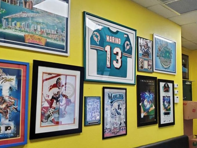Sports memorabilia adorns these cheerful walls, creating atmosphere where champions and sandwiches both find their glory.