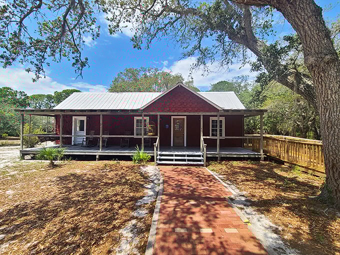 The Whitman House stands as a testament to Cedar Key's resilience – a charming red cottage that's weathered storms both literal and metaphorical.
