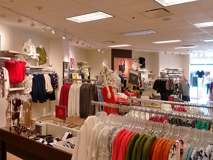 A women's clothing boutique where color-coding isn't just organizational but a visual feast that makes finding that perfect blouse feel like a treasure hunt with guaranteed success.