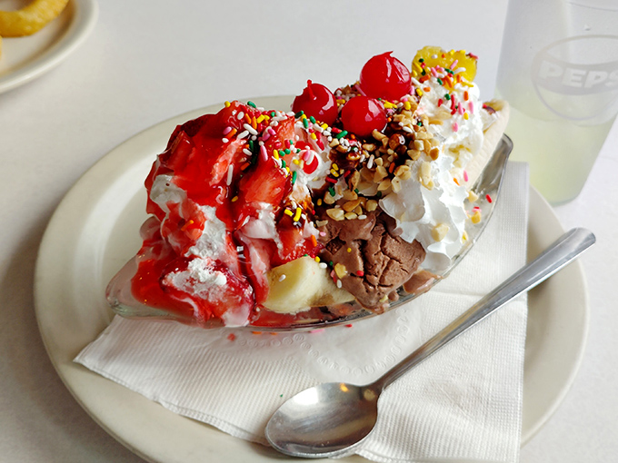 This banana split isn't just dessert—it's a carnival of flavors where cherries, sprinkles, and whipped cream compete for your attention like eager performers.