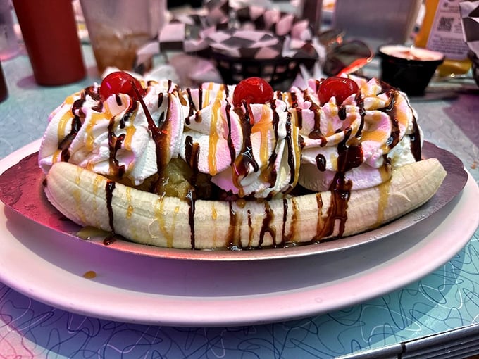 This banana split isn't dessert—it's a retirement plan for a banana that lived its best life and went out in a blaze of whipped cream glory.