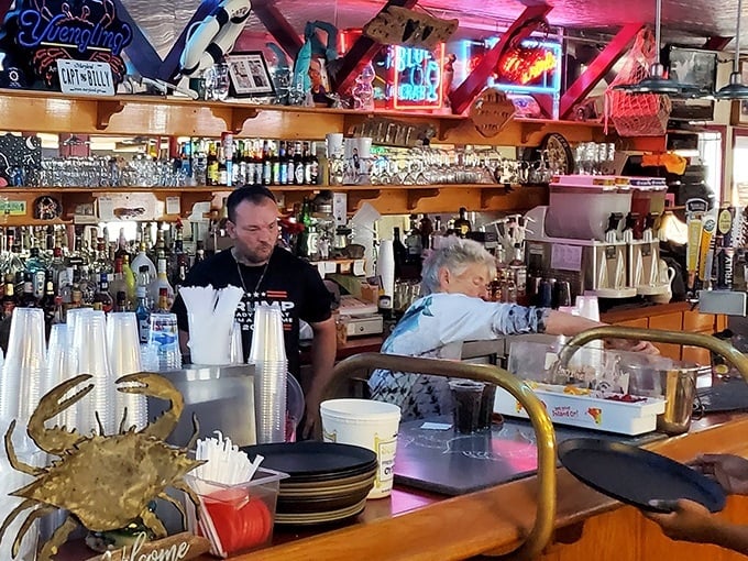 The bar at Captain Billy's – where locals and tourists unite in the universal language of "another round with these crabs, please."