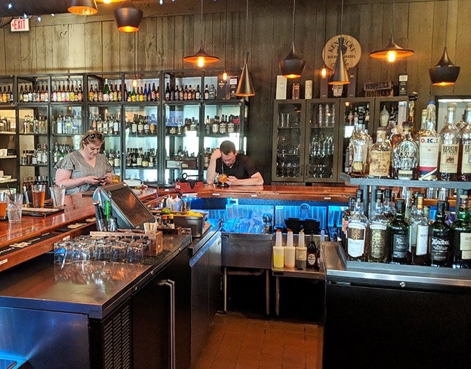 Behind this bar, bottles aren't just stored – they're showcased like the supporting characters in your evening's delicious story.