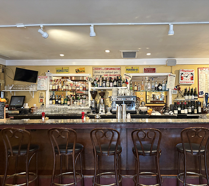 The bar at Bistro Jeanty feels like it's been there forever, a place where wine flows freely and strangers become friends over shared plates and Napa Valley stories.