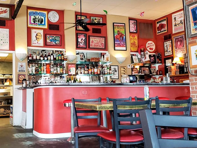 The bar area isn't just serving drinks—it's serving history, with every inch of wall space telling stories of Texas music legends and local heroes.
