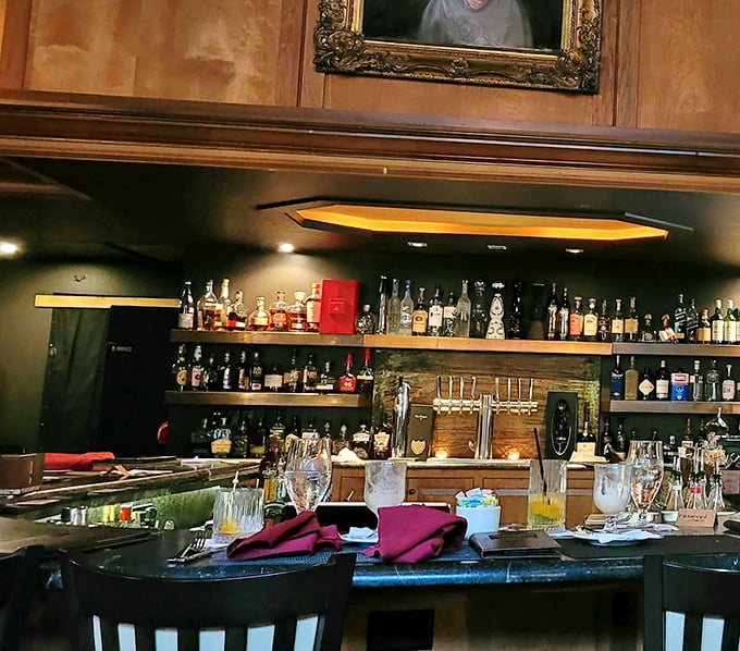 The bar area—where spirits meet spirits, and the selection rivals your coolest friend's liquor cabinet, only with better lighting.