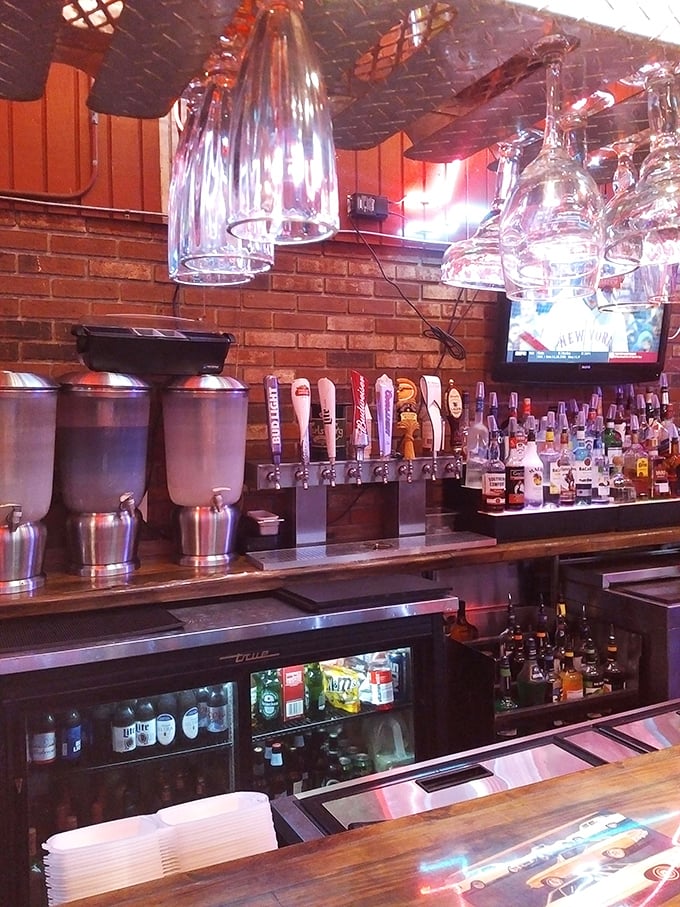 The bar area glows with promise, beer taps standing at attention like soldiers ready to serve. Those pendant lights have witnessed countless celebrations.