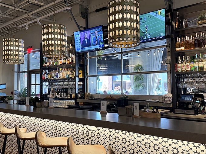 The impressive bar setup features pendant lighting that creates intimate conversation spots for every occasion.