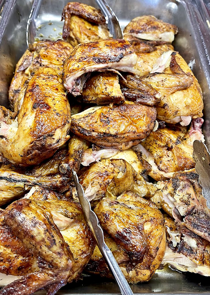 Barbecued chicken quarters glistening with smoky promise. The kind of chicken that makes you question why you ever ate it any other way.