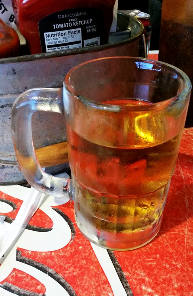 Cold beer in a frosty mug—the perfect companion to tame the Texas heat and wash down a burger that's bigger than some small apartments.