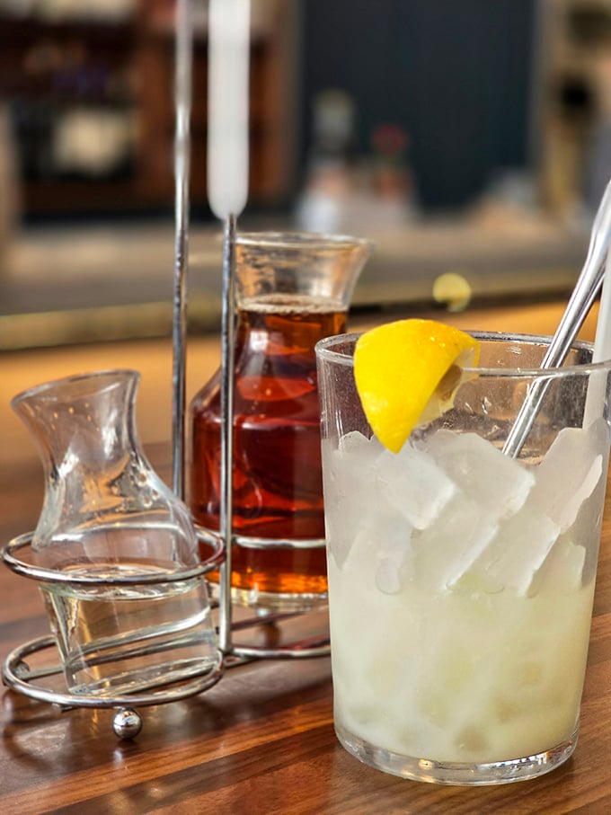 A properly made cocktail with fresh lemon and crystal-clear ice—because sometimes the perfect seafood companion isn't wine but something bracingly refreshing.