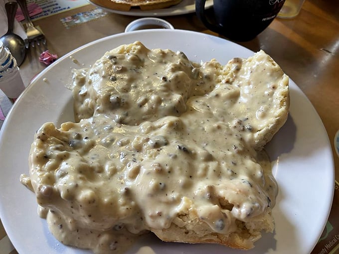 These biscuits aren't just smothered in gravy—they're embraced by it. A comfort food hug on a plate that whispers, "Everything's gonna be okay."