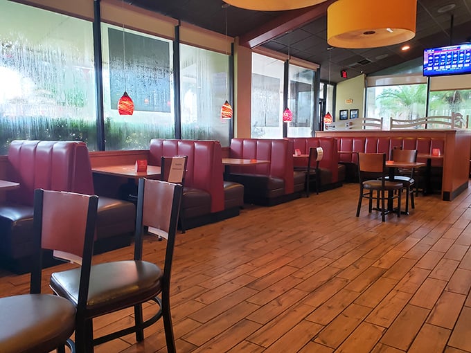 Red booths – the universal signal for "sit here, stay awhile, and maybe order dessert" in the international language of comfort dining.