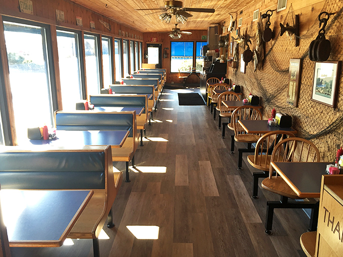 Classic booth seating with fishing nets and maritime décor – where every meal feels like you're dining in the captain's quarters of a particularly delicious ship.