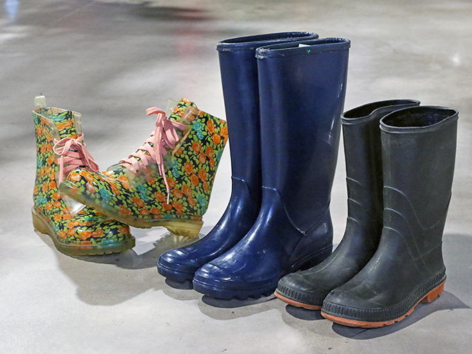 Rain boots lined up like colorful soldiers – practical armor against Pennsylvania's notorious puddles, with one pair rebelliously sporting flowers.